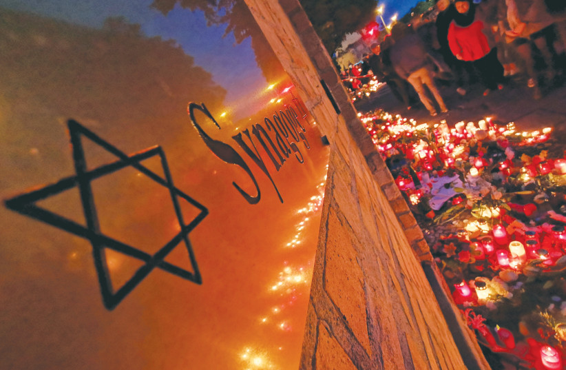 Swastikas painted over tributes to synagogue attack victims in Halle ...