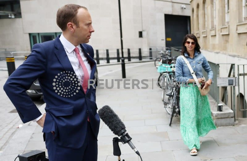 UK health secretary quits after breaking COVID rules by kissing aide ...