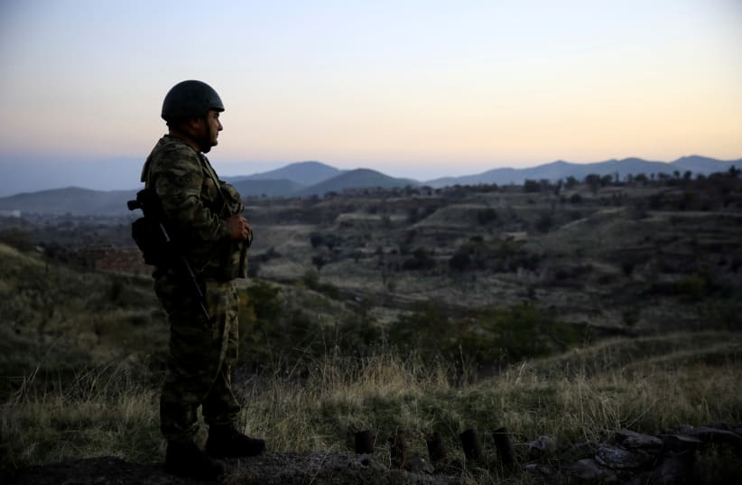 Armenia reports truce after intense clashes with Azerbaijan - The ...