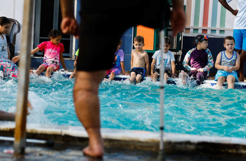 Palestinian amputee sparks inspiration for young swimmers in Gaza - The ...